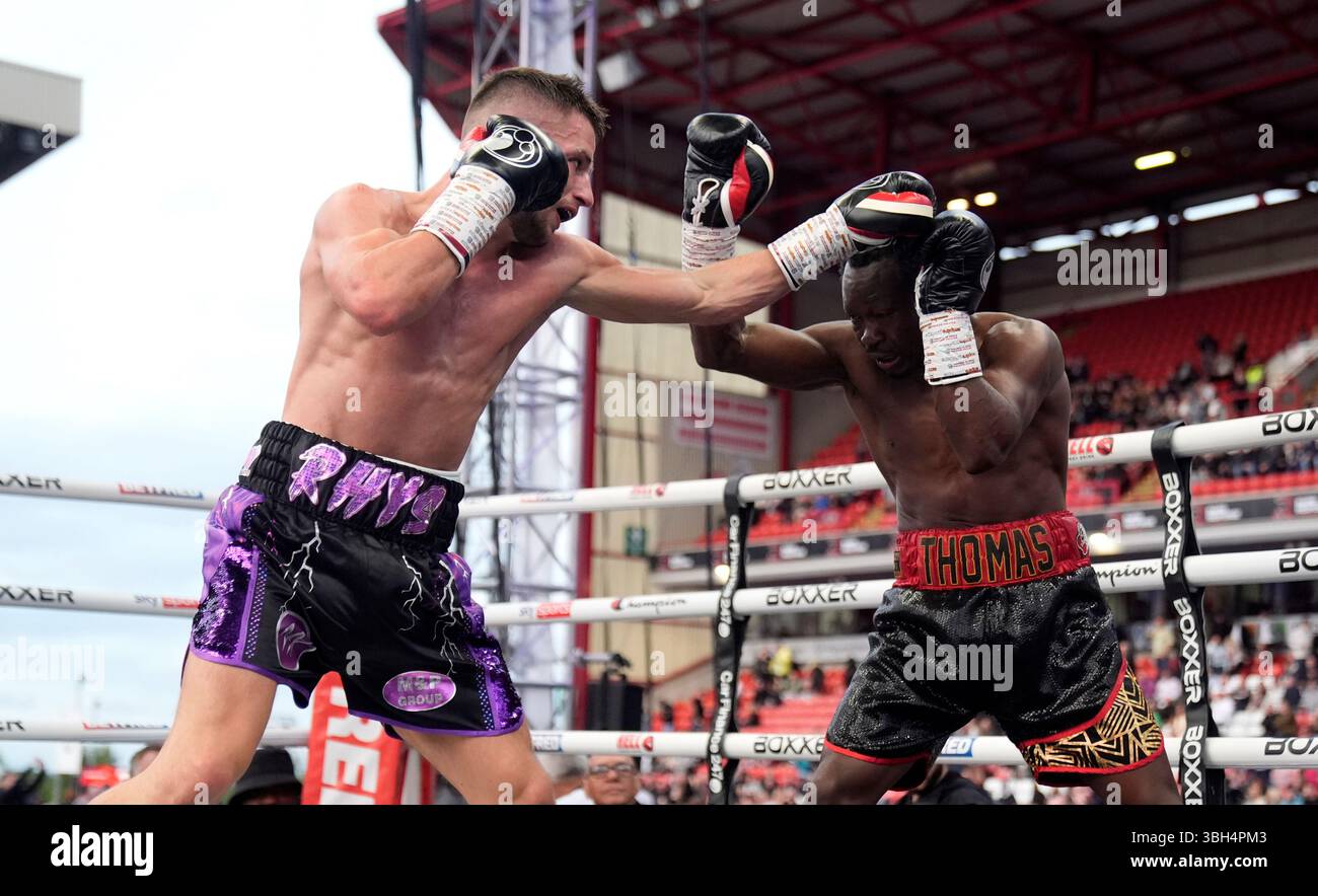 Rhys Edwards (left) in action against Thomas Essomba (right) at Oakwell ...
