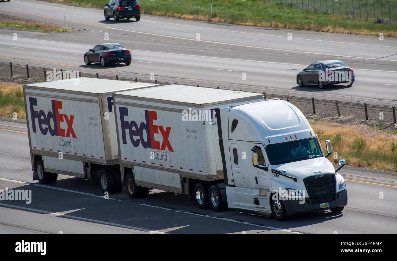 SANTAQUIN, UT – JUNE 8, 2025: FedEx truck on I-15 hauls two containers ...