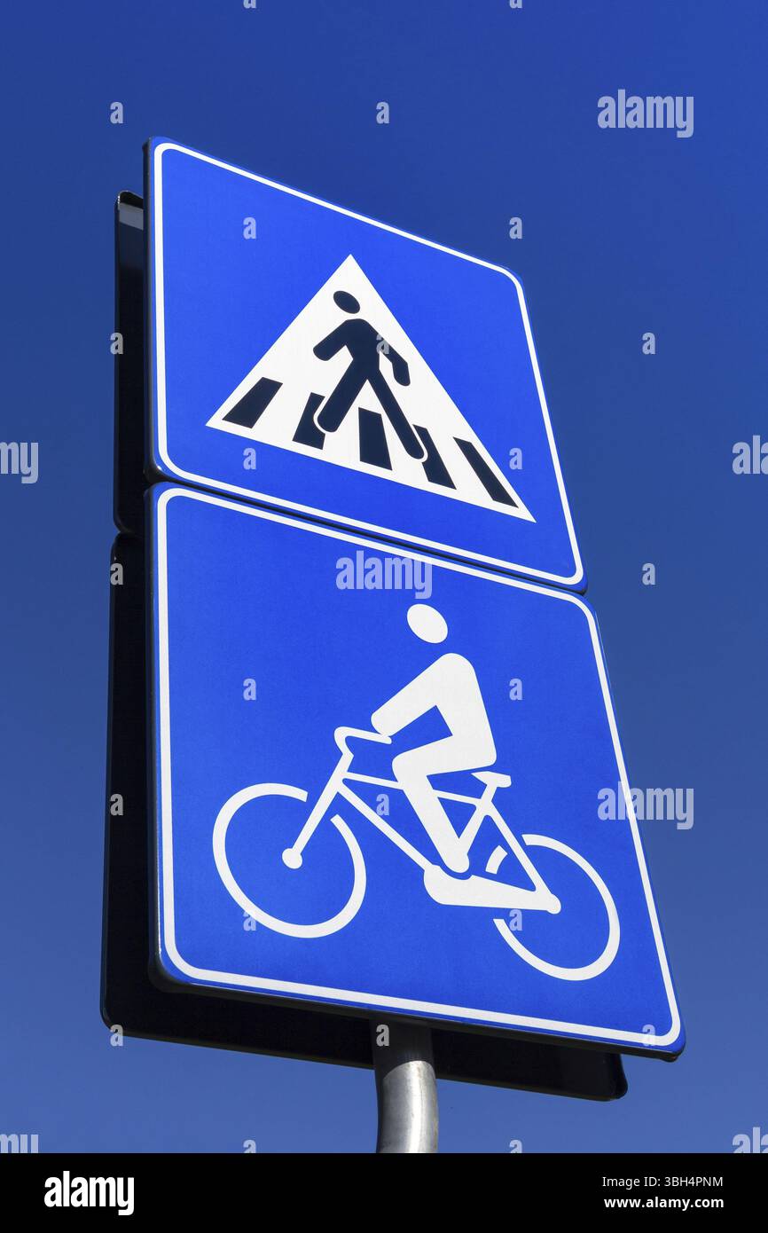 Road sign warns about pedestrian crossing and bicycle road Stock Photo ...