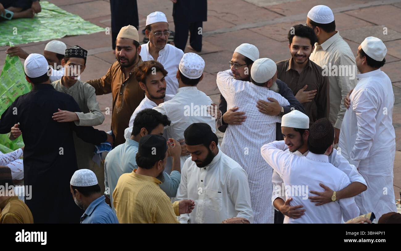 NEW DELHI, INDIA - JUNE 7: Muslims greet after offering Namaz at ...