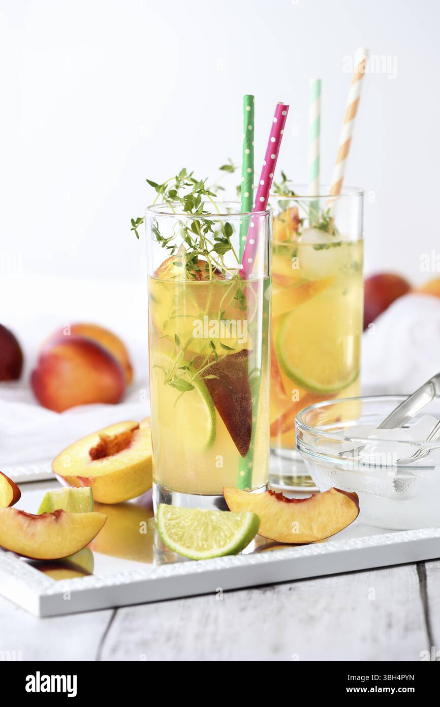 Peach summer cocktail. Refreshing organic non-alcoholic drink, lemonade ...