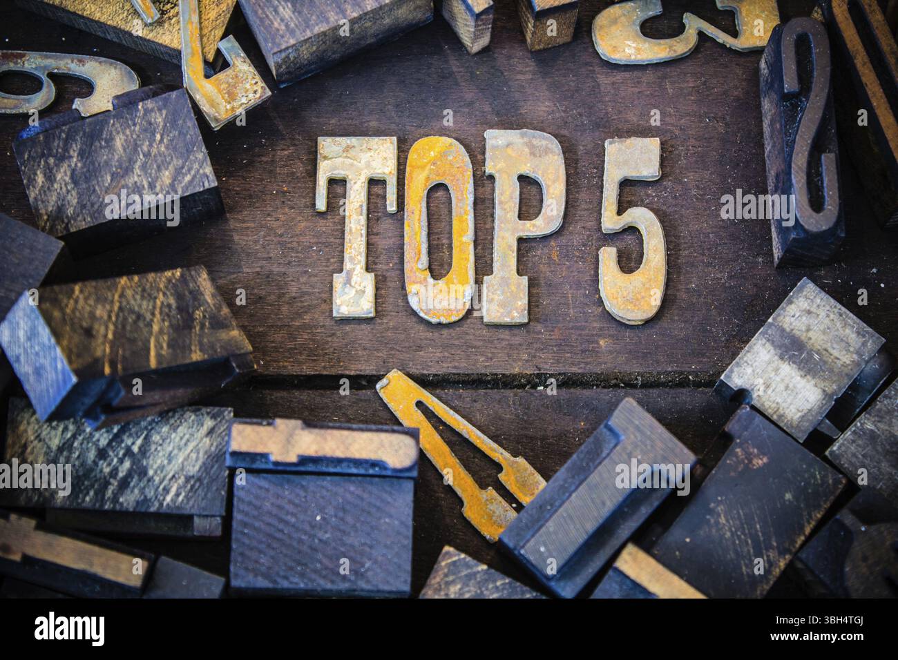The words TOP 5 written in rusted metal letters surrounded by vintage ...