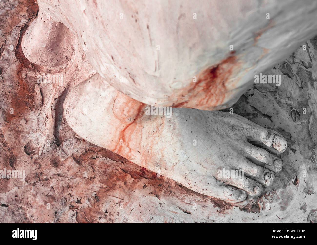 Extreme close-up of the feet of Jesus Christ bloodied. Top view ...