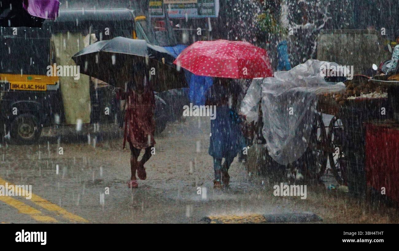 MUMBAI, INDIA - JUNE 7: People stuck during heavy rains in Thane city ...