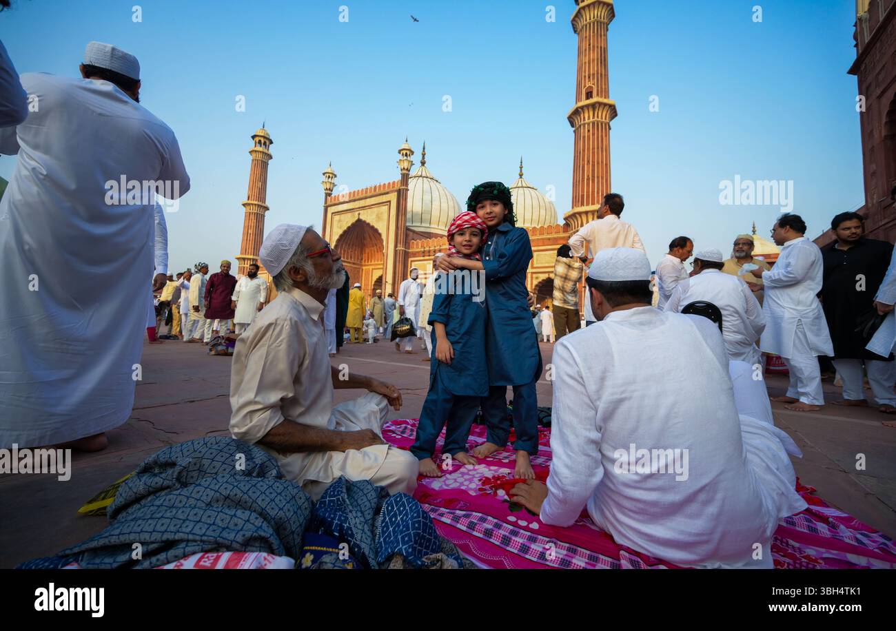 NEW DELHI, INDIA - JUNE 7: Muslims embrace after offering Eid al-Fitr ...