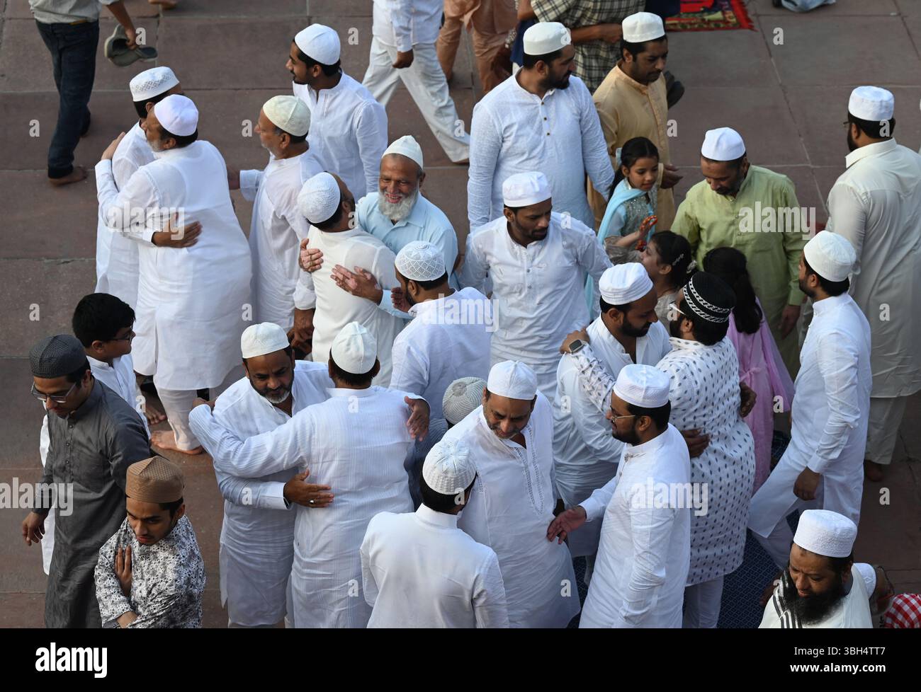 NEW DELHI, INDIA - JUNE 7: Muslims greet after offering Namaz at ...