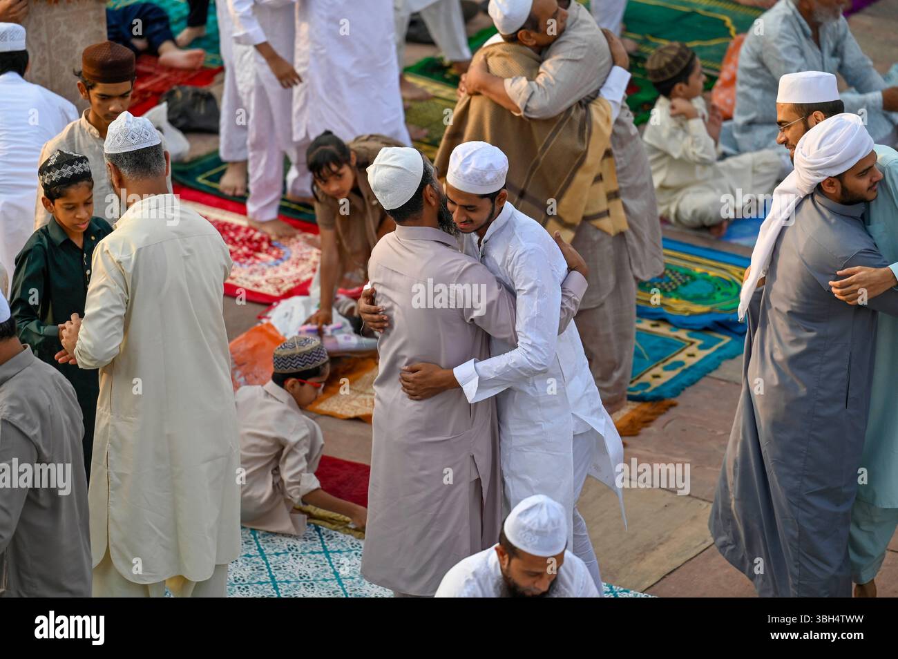 NEW DELHI, INDIA - JUNE 7: Muslims embrace after offering Eid al-Fitr ...