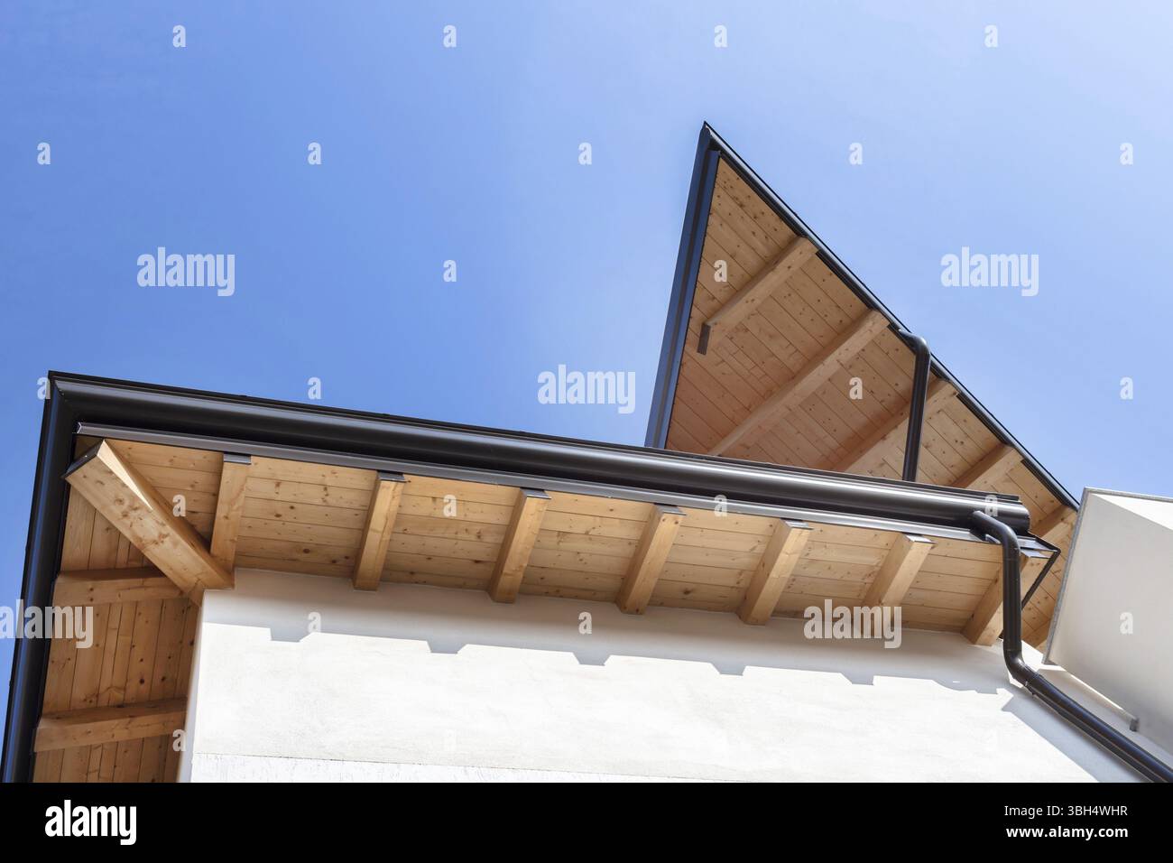 New wooden warm ecological house roof with steel gutter rain system ...