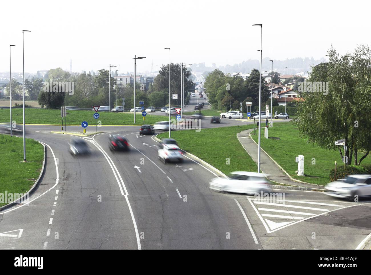 Road traffic at roundabout junction Stock Photo - Alamy