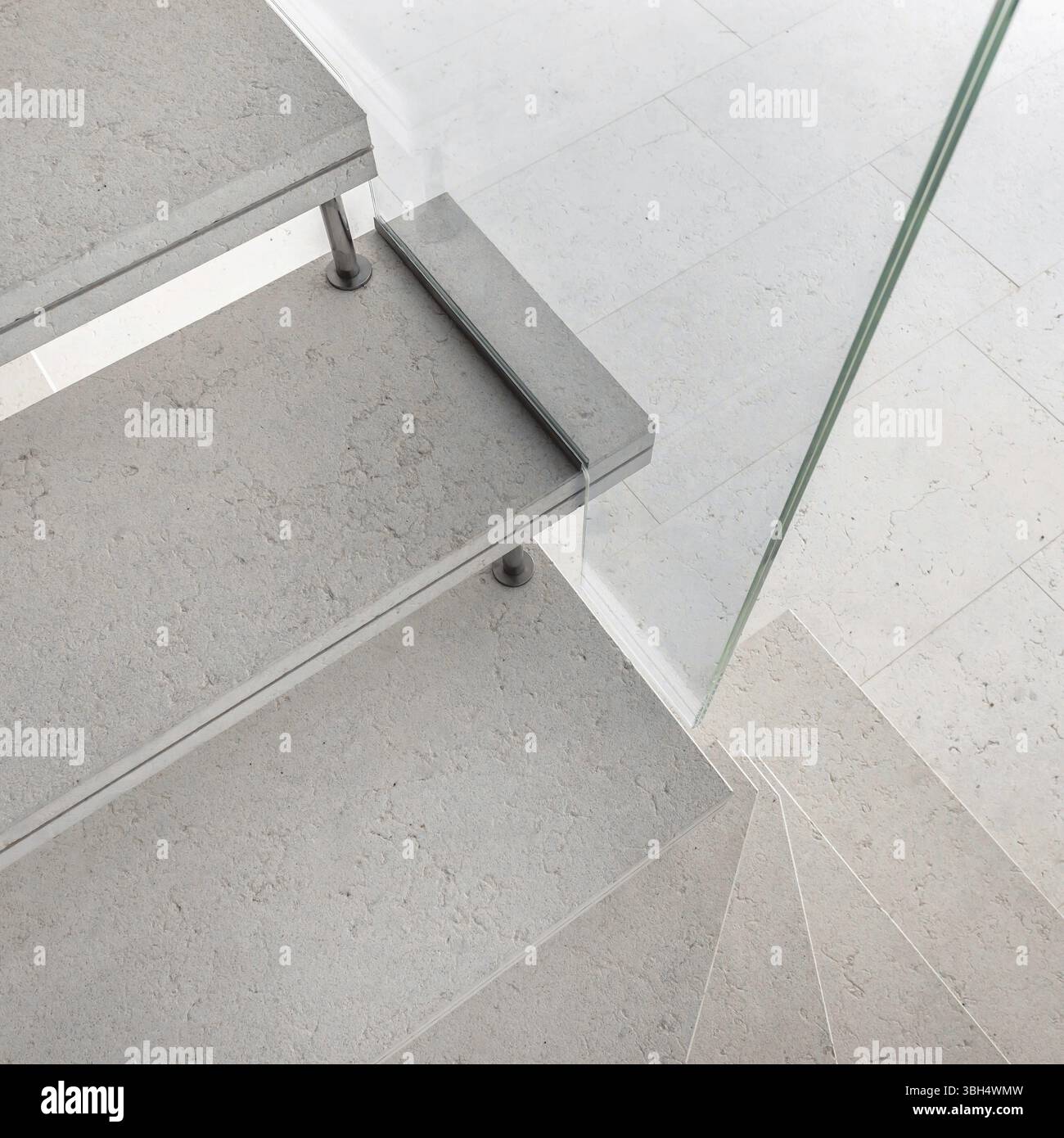 Microcement stairs with glass handrail. Stairs viewed from above ...