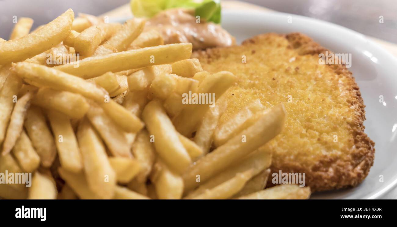 Italian food. Cutlet Milanese with french fries. Close-up Stock Photo ...