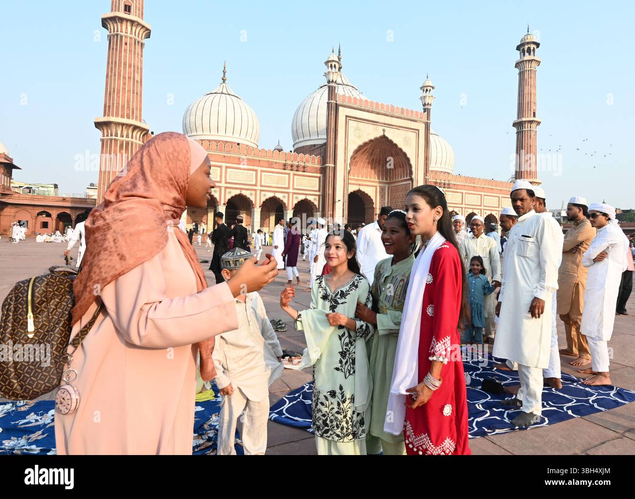 NEW DELHI, INDIA - JUNE 7: Muslims greet after offering Namaz at ...