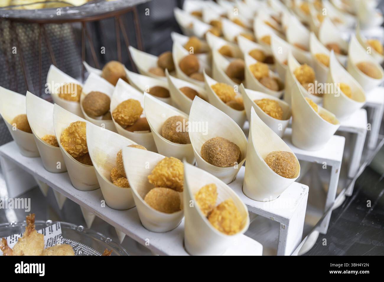 Fried Appetizers in paper cones for a party. Various tastes Stock Photo ...