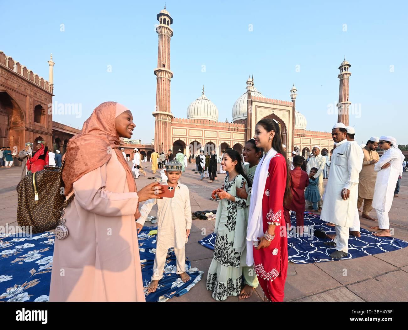NEW DELHI, INDIA - JUNE 7: Muslims greet after offering Namaz at ...