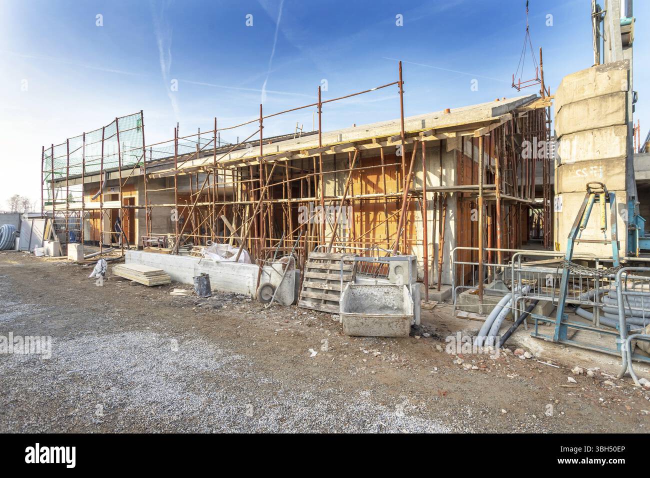 Construction residential new house in progress at building site housing ...