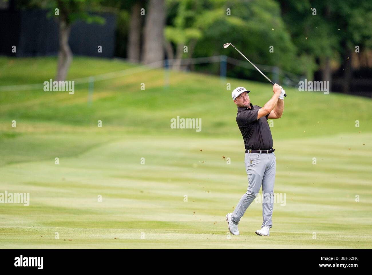 Graeme McDowell of Smash GC hits his shot from the seventh fairway ...