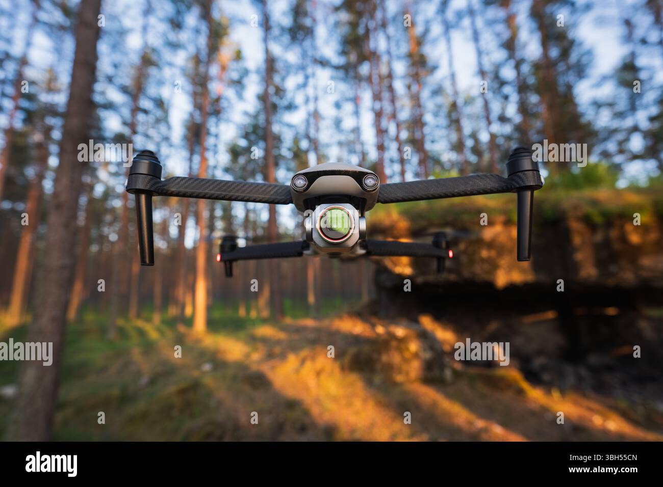 Camera flying in pine forest hi-res stock photography and images - Alamy