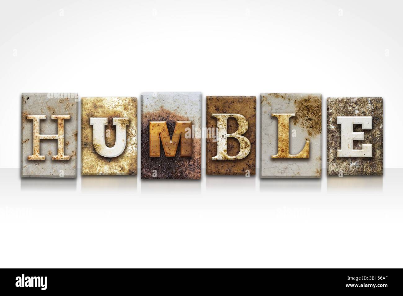 The word HUMBLE written in rusty metal letterpress type isolated on a ...