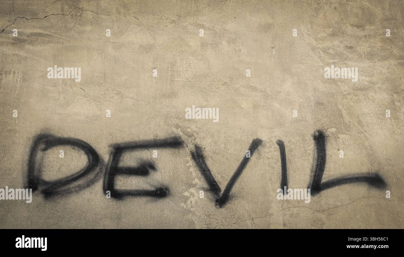 The word devil on grungy wall Stock Photo - Alamy