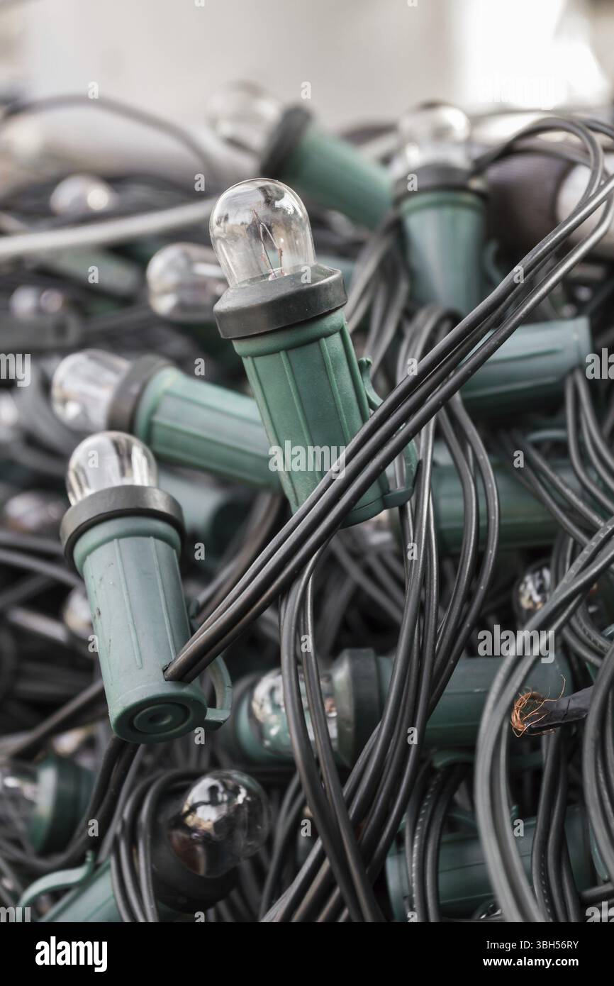 Mess of tangled old-style Christmas lights. Shallow DOF Stock Photo - Alamy