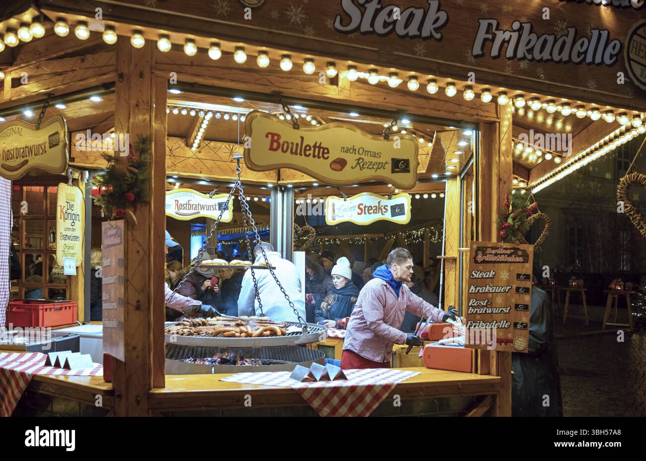 Typical stall selling sausages and snacks at a Christmas market in ...