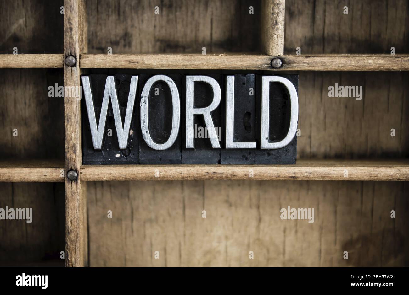 The word WORLD written in vintage metal letterpress type in a wooden ...