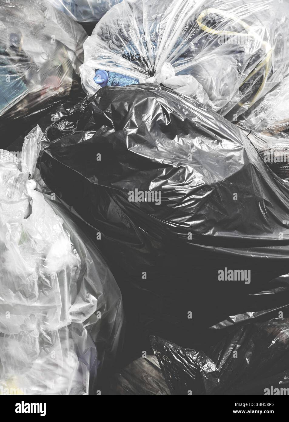 Garbage bags. Piles of garbage in plastic bin bags. Landfill. Close-up ...