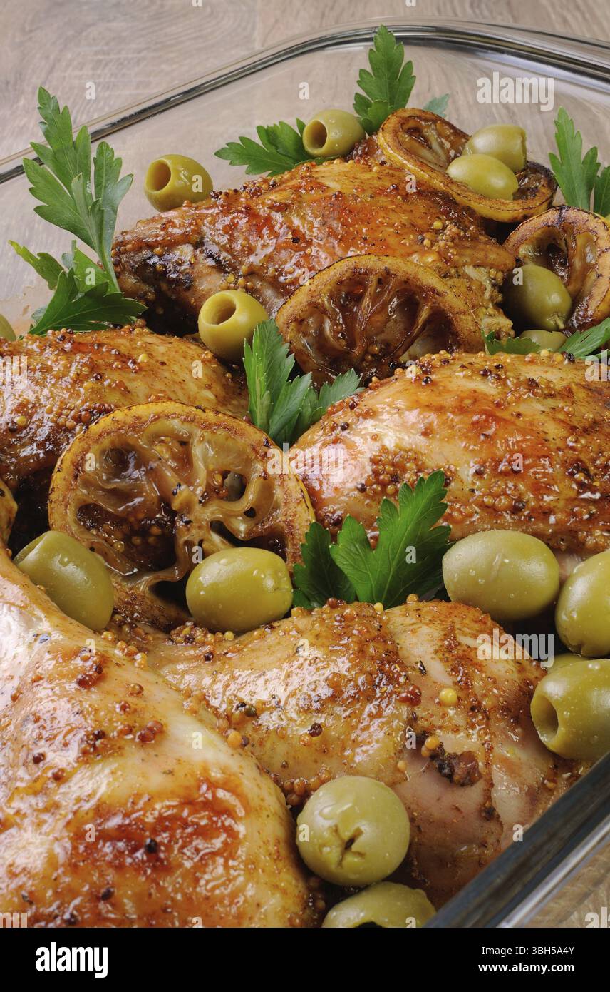 Parts of chicken baked with olives marinated in lemon Stock Photo - Alamy
