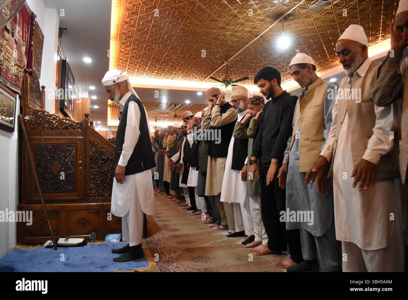 Srinagar, India. 07th June, 2025. The Imam heads the Eid ul-Adha sermon ...