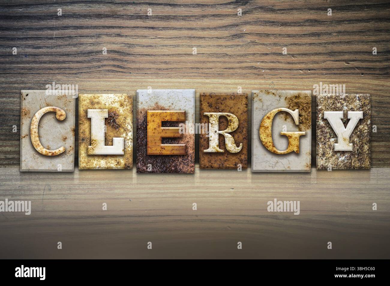 The word CLERGY written in rusty metal letterpress type sitting on a ...
