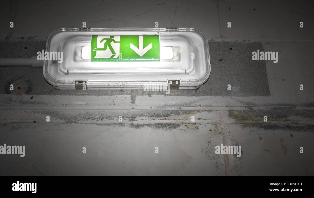 Old emergency exit sign covered in dirt and cobwebs Stock Photo - Alamy