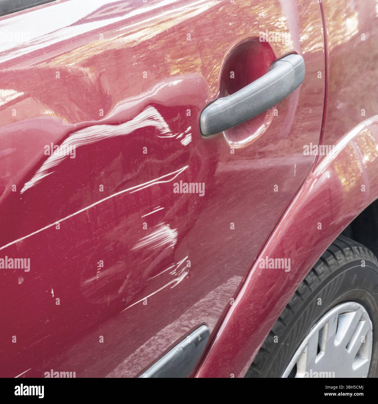 Scratched and dented car. Collision or accident. Scratches on the side ...
