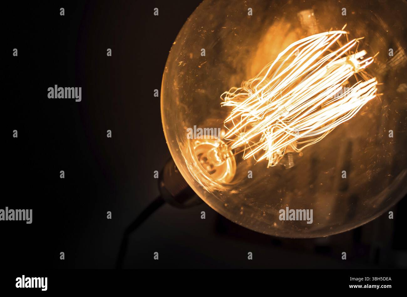 Close up glowing light bulb. Vintage lamp background. Shallow DOF Stock ...
