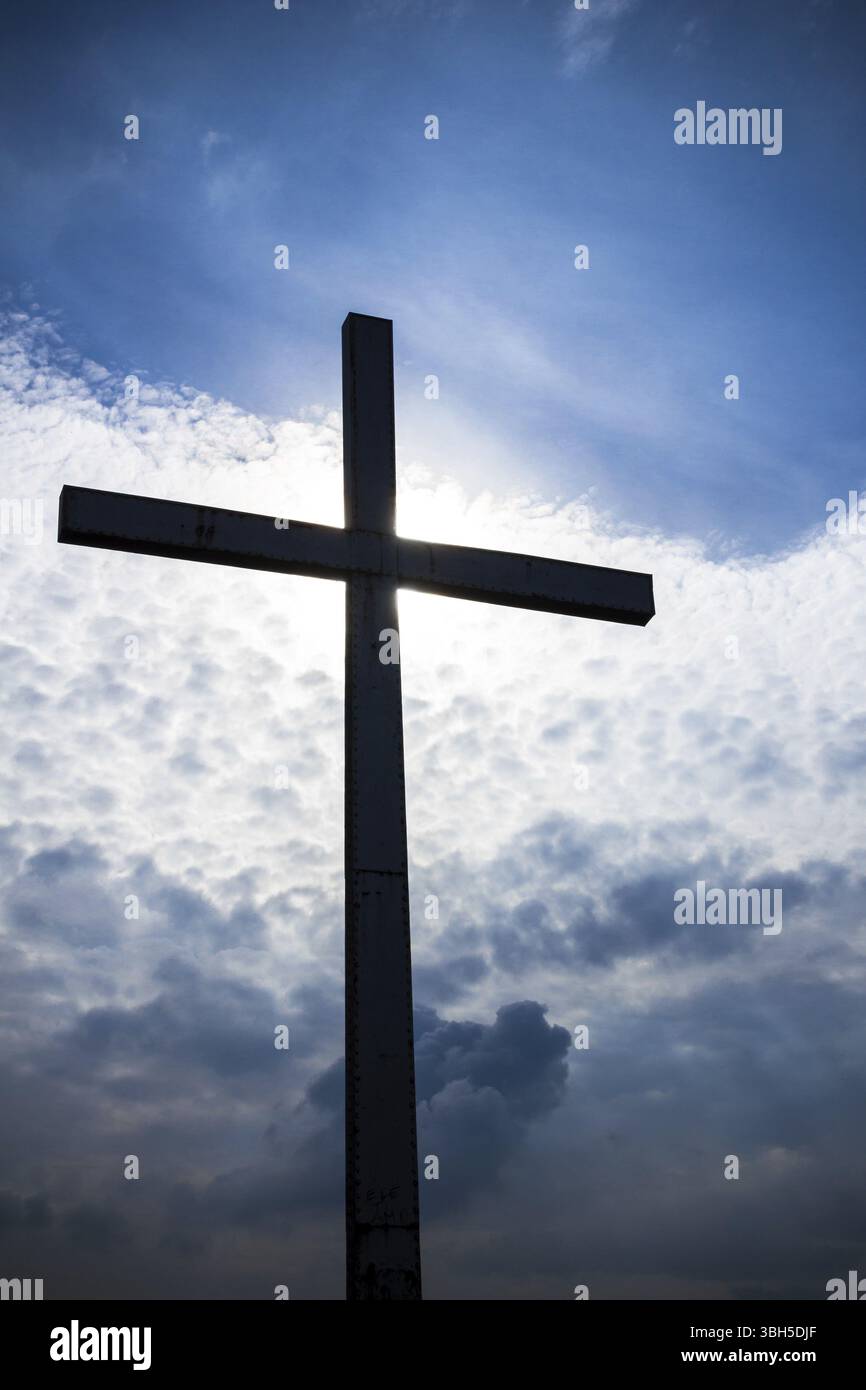 A large iron cross, immortalized in backlight Stock Photo - Alamy