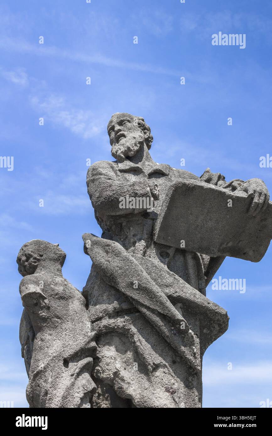 Statue of an old teacher with mutilated hand and his student Stock ...