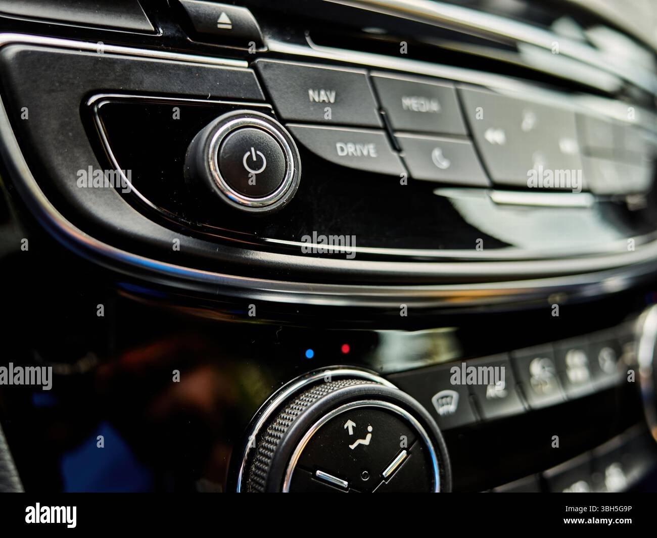Car radio with buttons for music, volume, and other settings. The ...