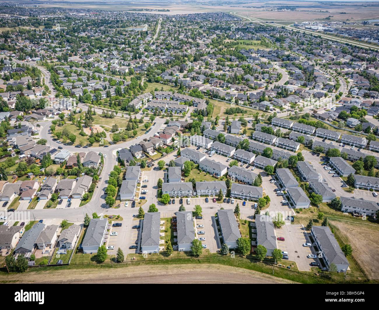 Residential area with many houses and a lot of parking lots. The houses ...