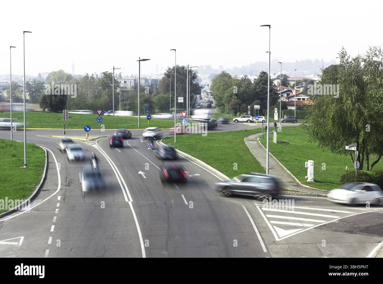 Road traffic at roundabout junction Stock Photo - Alamy