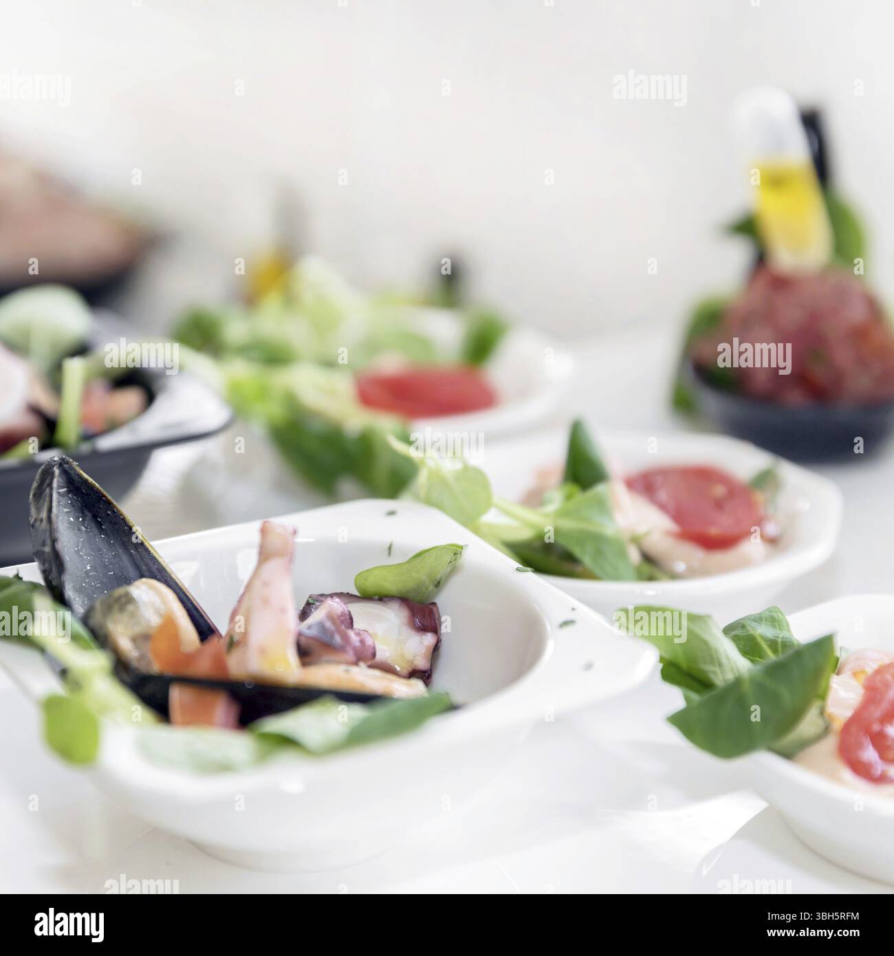 Seafood snacks on a buffet table. Assorted mini quick, delicacies and ...