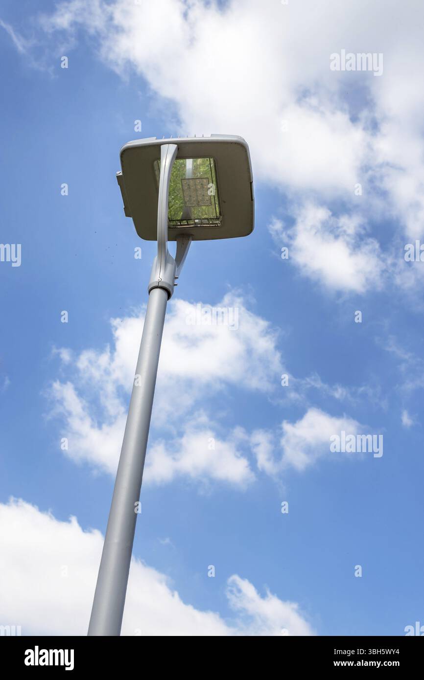 Led street lamp post on blue sky background with white clouds. Led ...