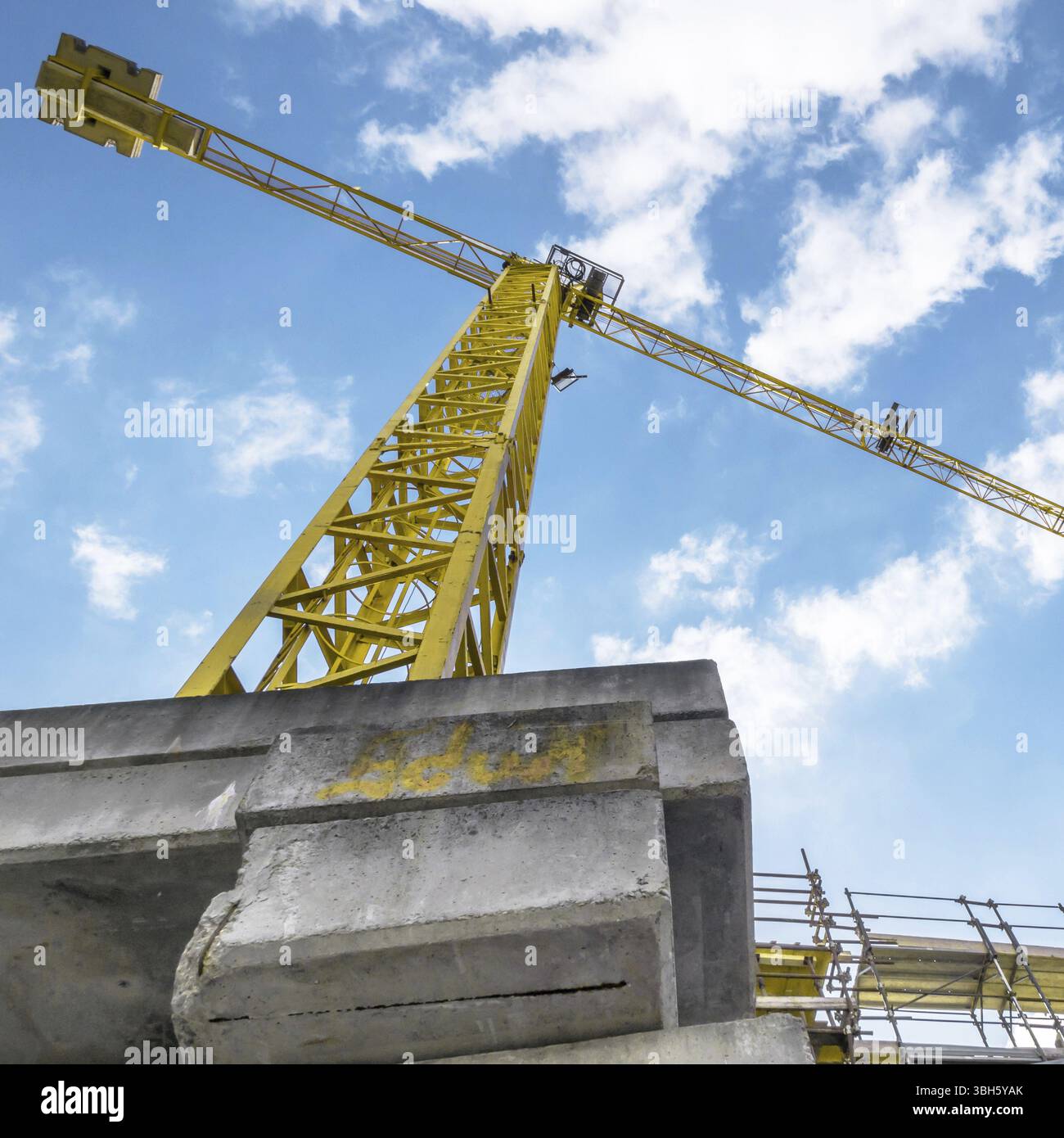 Crane and building under construction. Extensive scaffolding providing ...