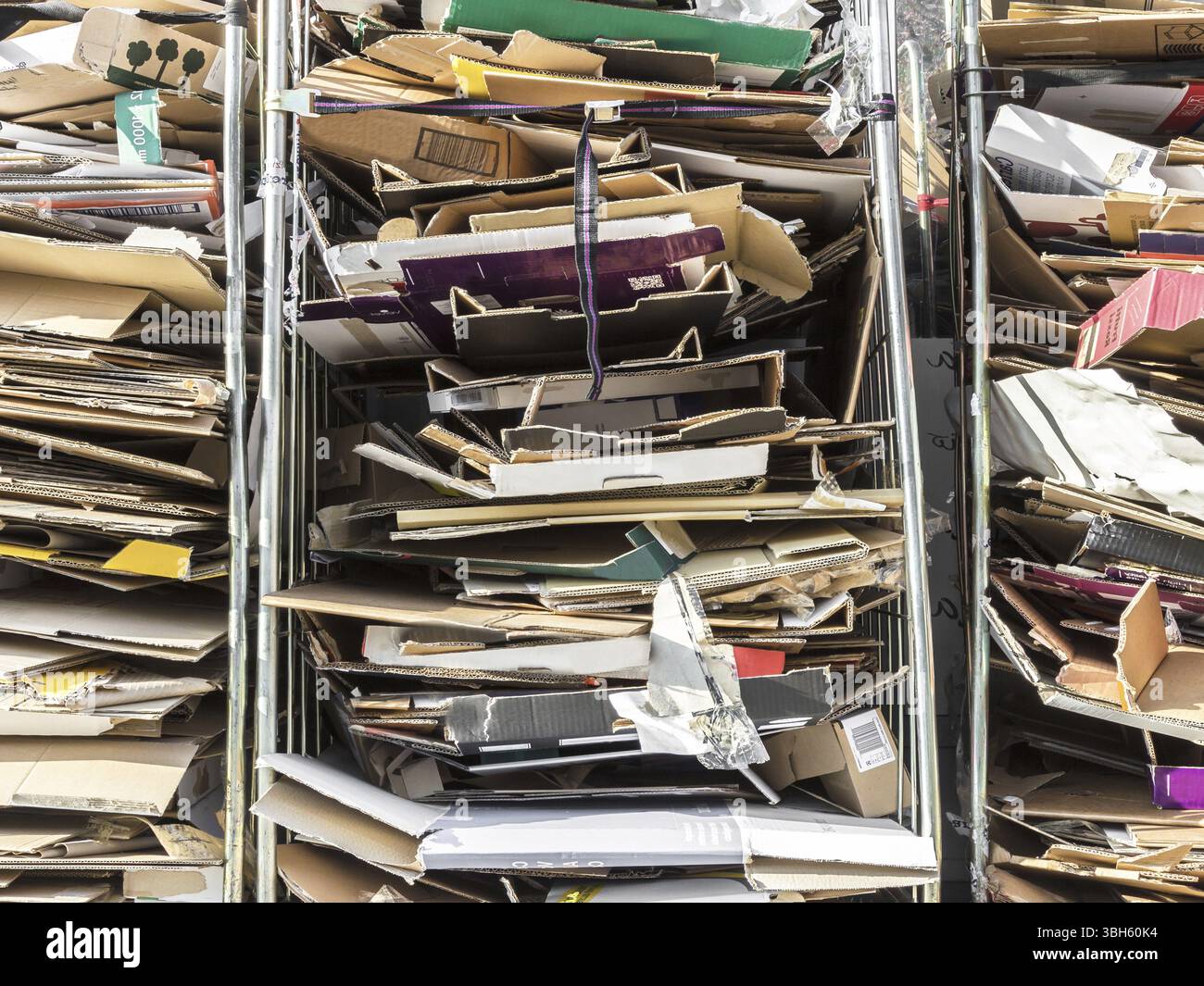 Stack of paper for recycling in metal containers Stock Photo - Alamy