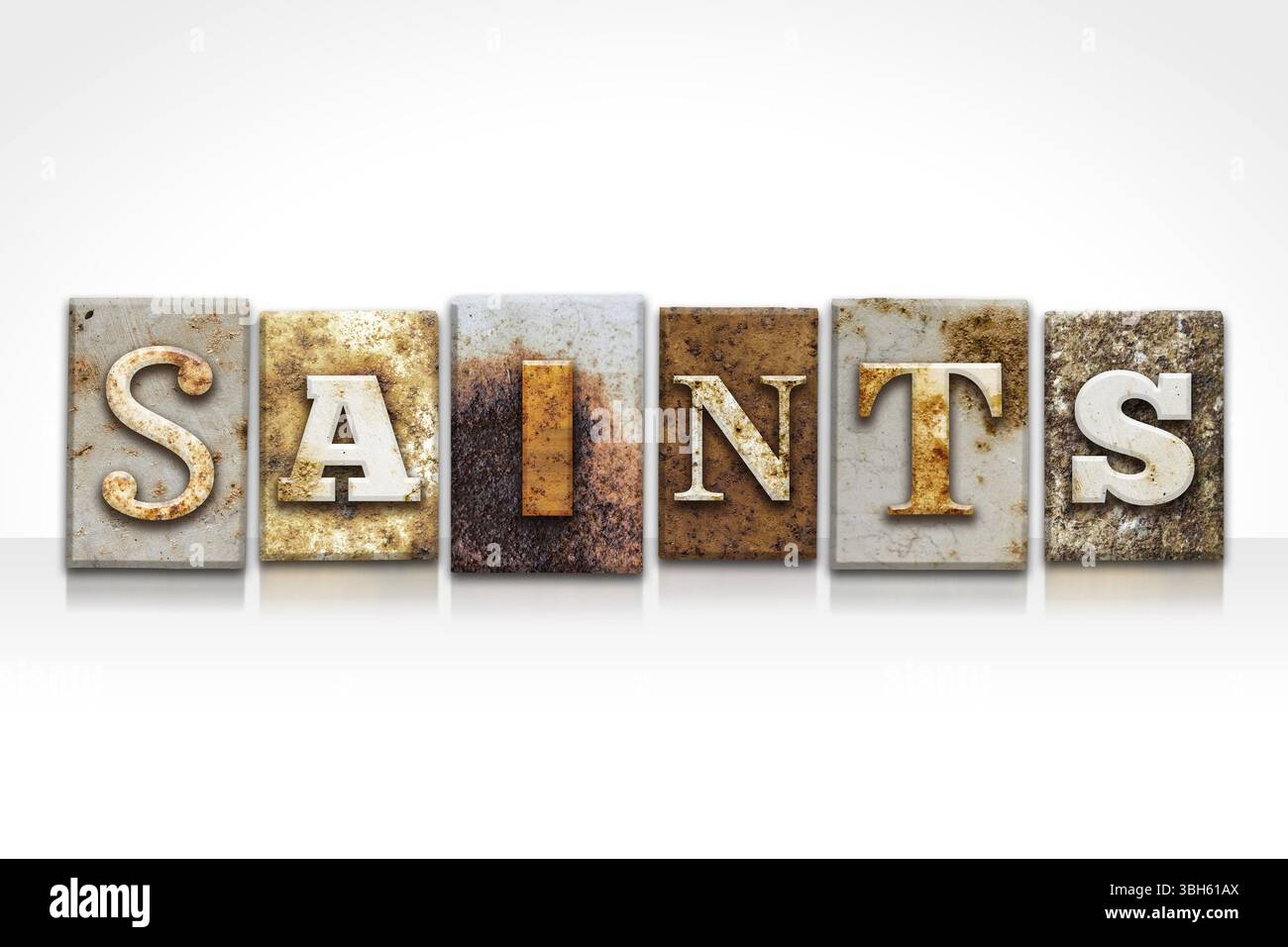 The word SAINTS written in rusty metal letterpress type isolated on a ...
