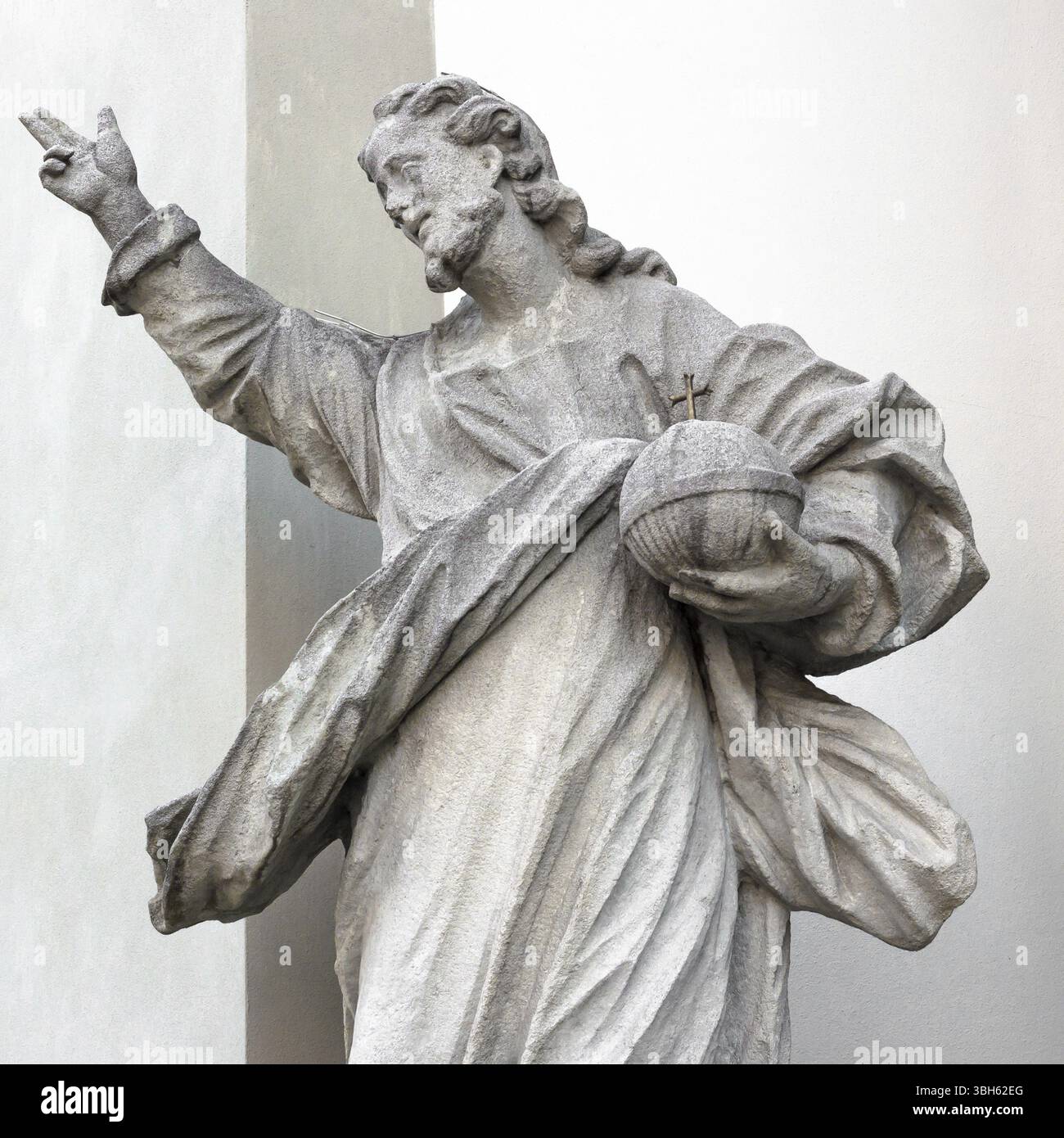 Statue of God, in his hand he holds the planet Earth Stock Photo - Alamy
