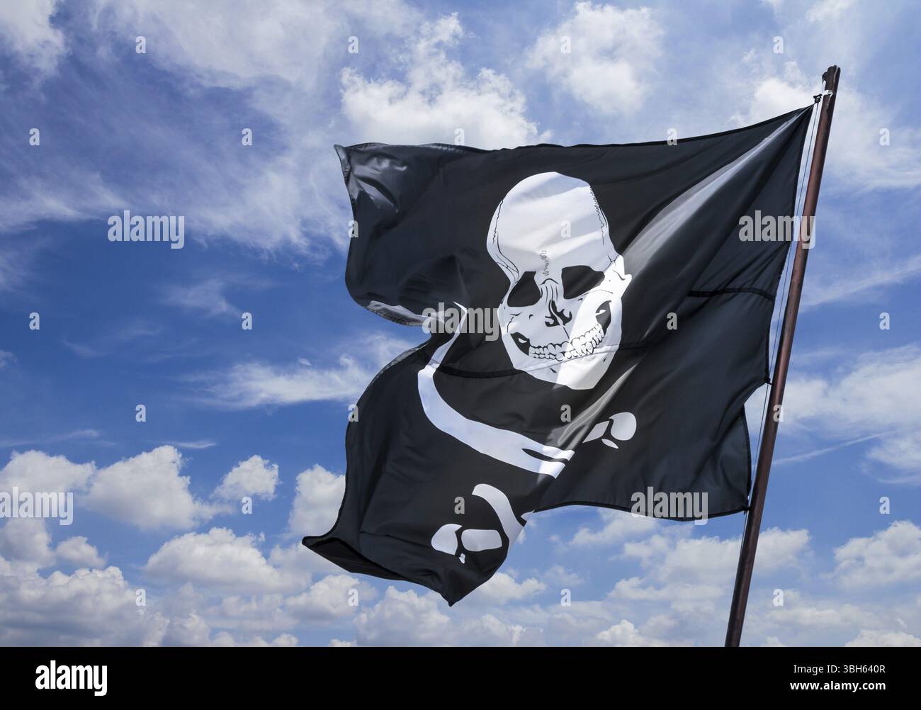 Pirates flag in the wind, depicting the skull and crossbones as a ...
