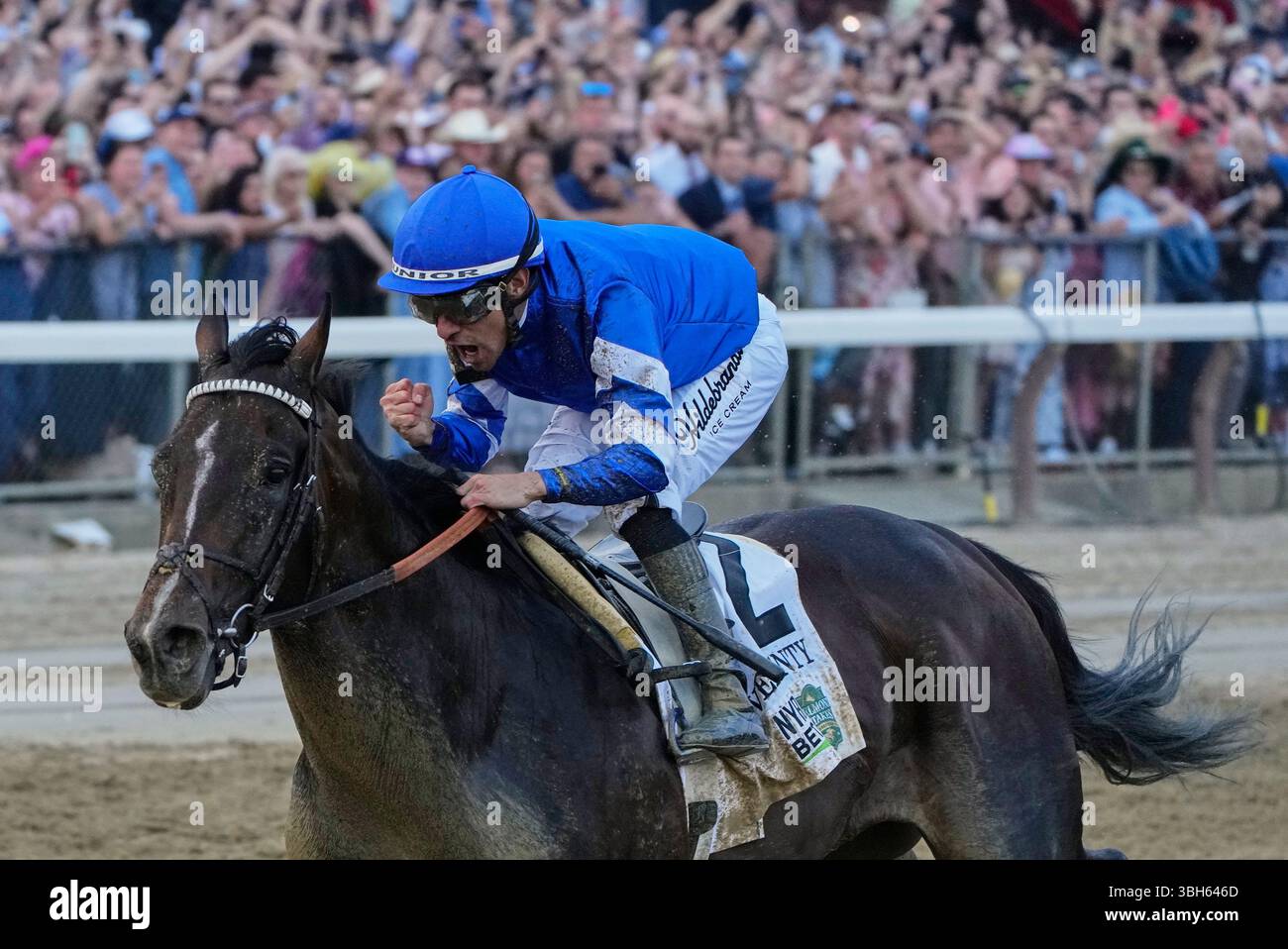 Jockey Junior Alvarado reacts aboard Sovereignty (2), as he crosses the finish line to win the ...