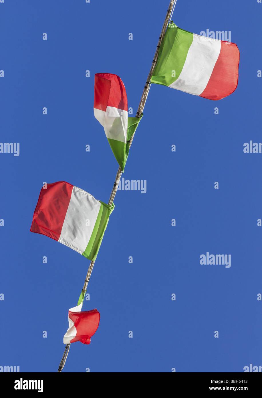 Small Italian flags related to a high-tension wire Stock Photo - Alamy