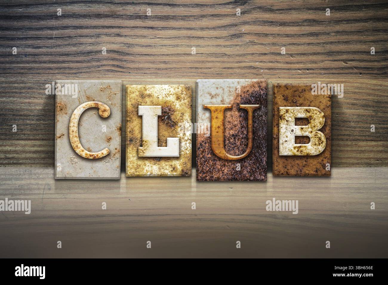 The word CLUB written in rusty metal letterpress type sitting on a ...