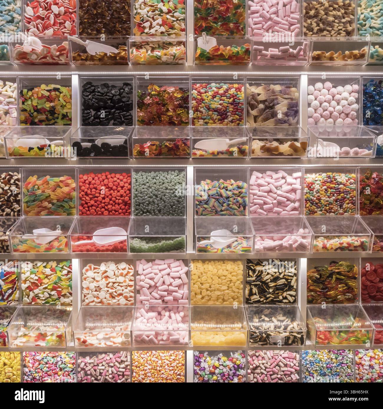 Candy display on a market. Various sweets for self-service Stock Photo ...