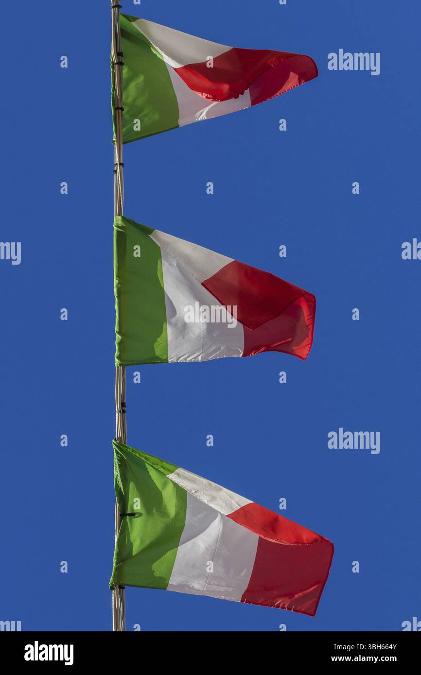 Small Italian flags related to a high-tension wire Stock Photo - Alamy